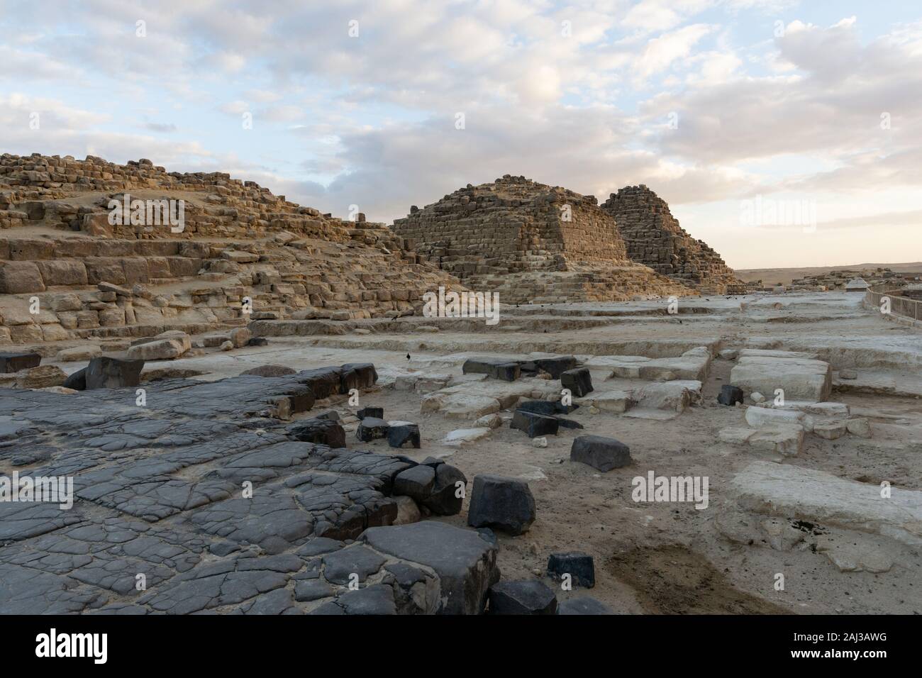 Black basalt blocks and three little pyramids near Pyramid of Khufu (or ...