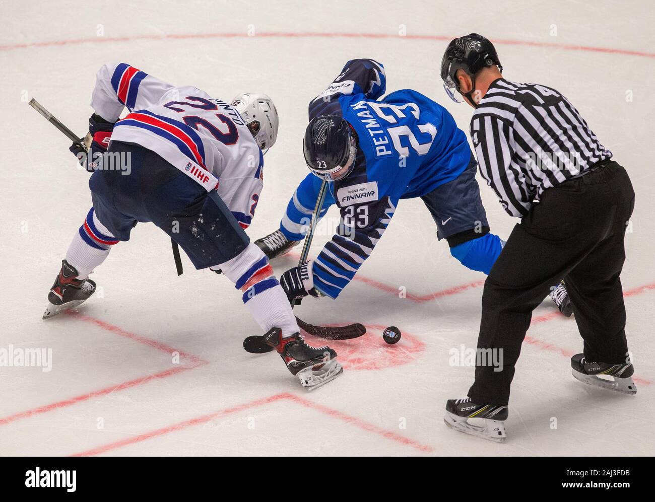 Trinec, Czech Republic. 02nd Jan, 2020. L-R Shane Pinto (USA) and Ville Petman (FIN) on bully ...