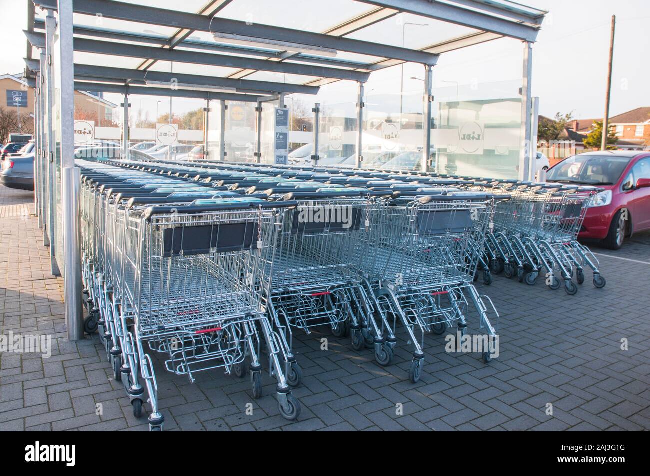 Supermarket shopping trolleys undercover in trolley stacking bay Stock ...