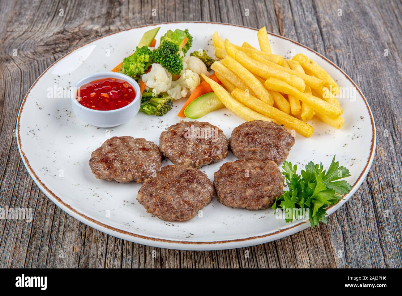 Delicious Turkish Traditional Kebab Kofta with and Fries on white plate ...