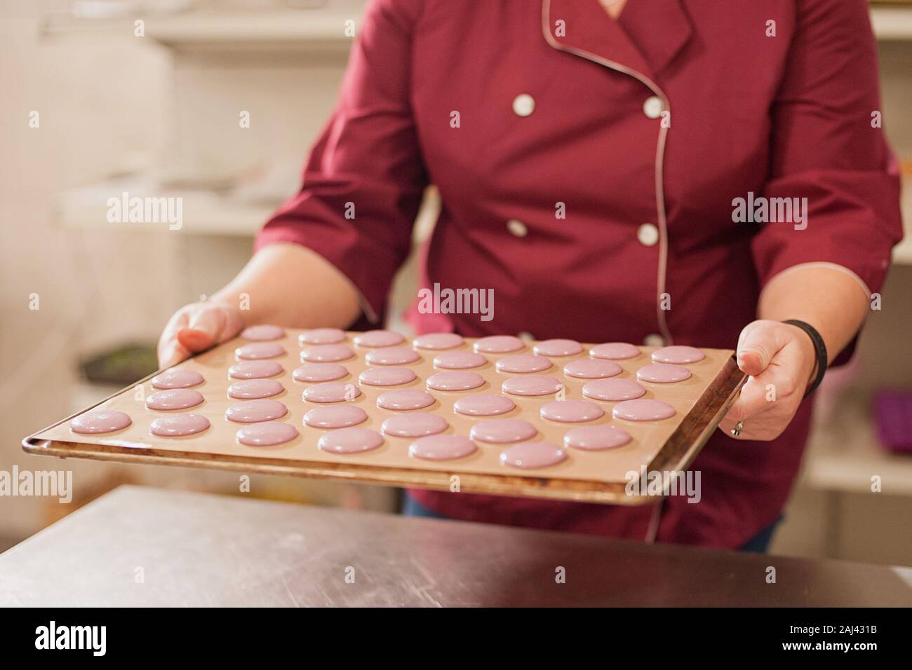 Process of making macaron macaroon, french dessert, squeezing the dough form cooking bag. Food ...