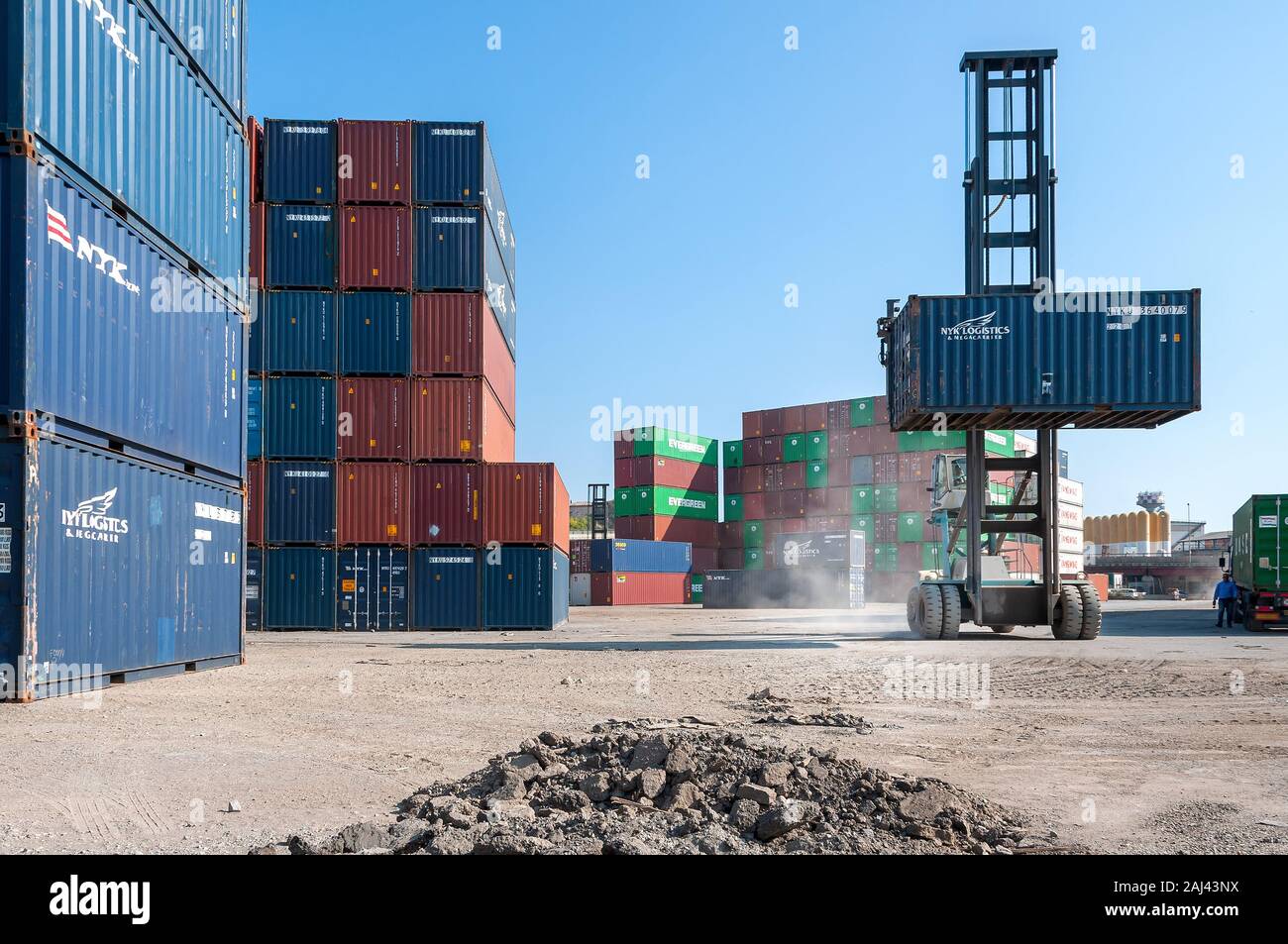 View of the container storage area - Worker on special vehicle - Genoa ...