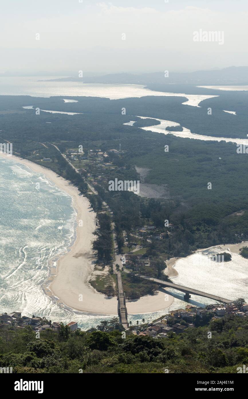 View from mountain top to river mouth, ocean and restinga vegetation ...