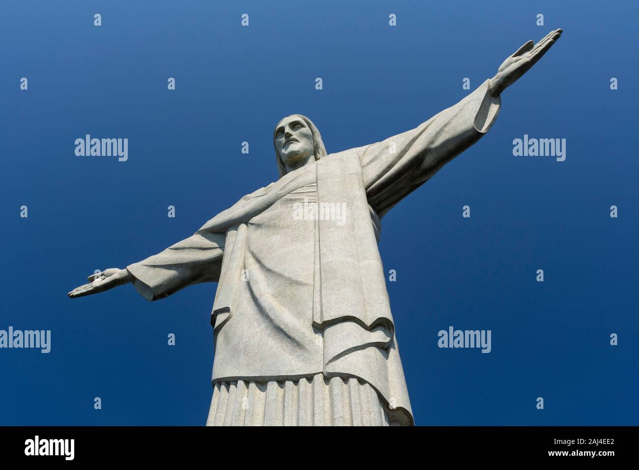 Christ the Redeemer Statue on top of Corcovado Mountain with blue sky ...