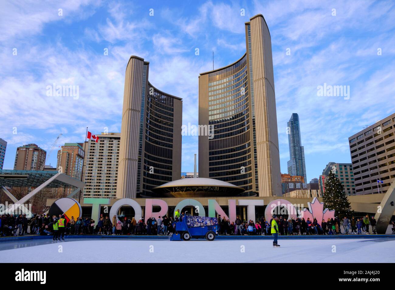 Ice cleaning machine on skating rink in front of Iconic Toronto sign at ...