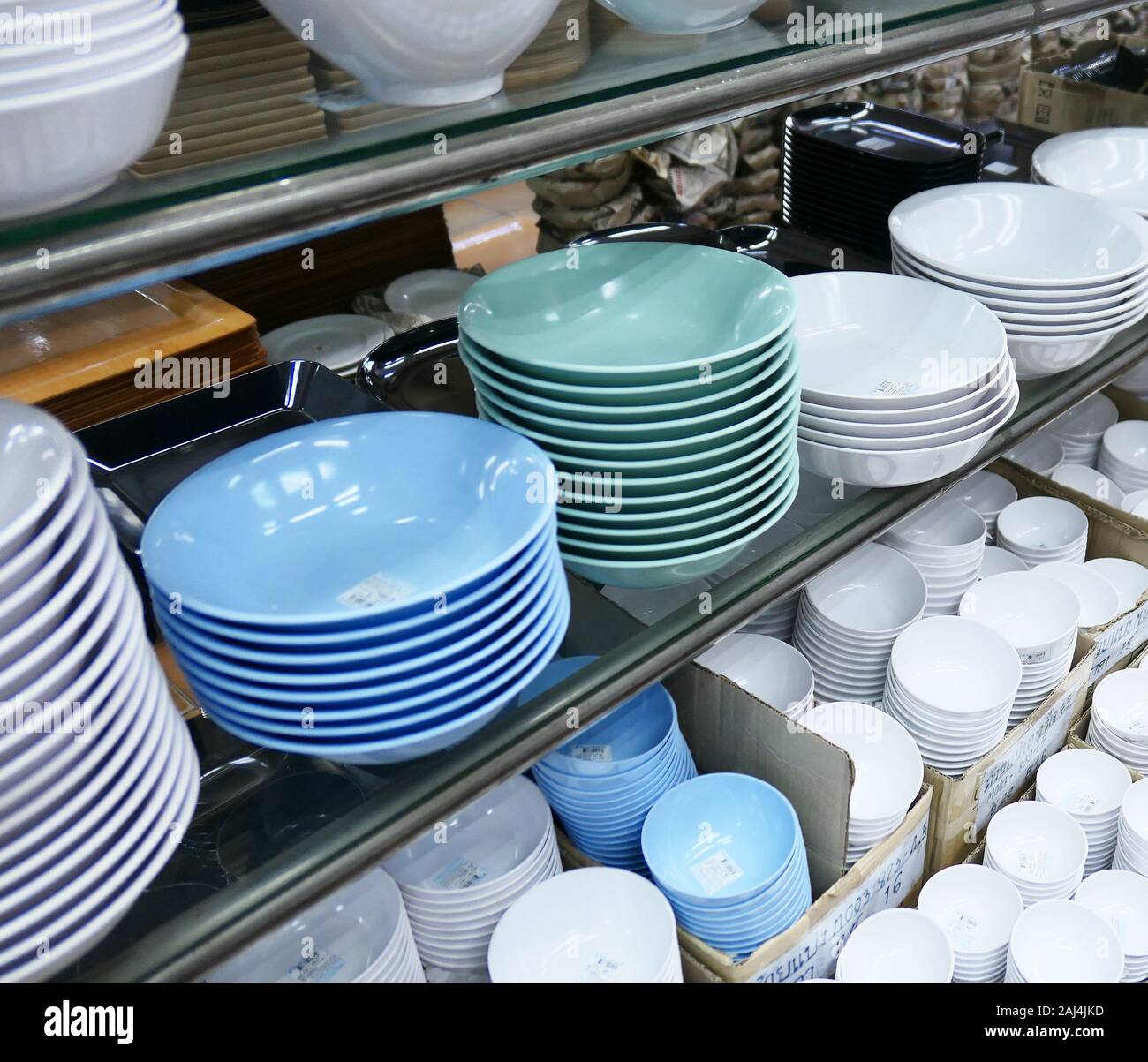 Stacks of plates in a shop Stock Photo - Alamy