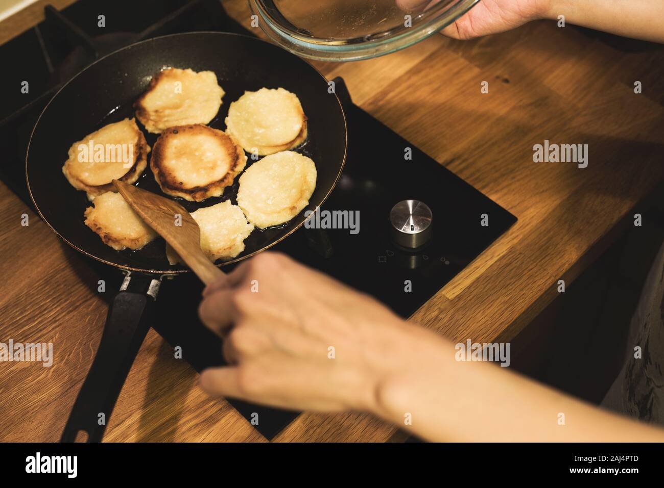 Person cooking gas stove hi-res stock photography and images - Alamy