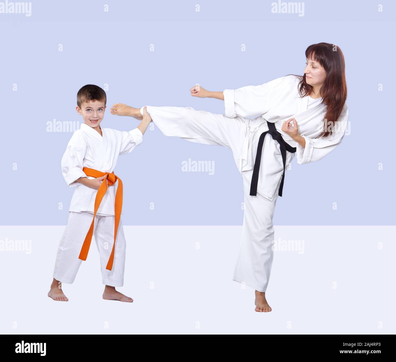 Son is keeping the mum leg after hitting Stock Photo - Alamy