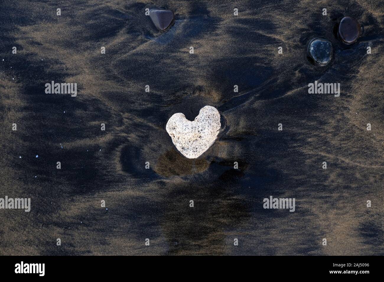 Black lava rock heart hi-res stock photography and images - Alamy