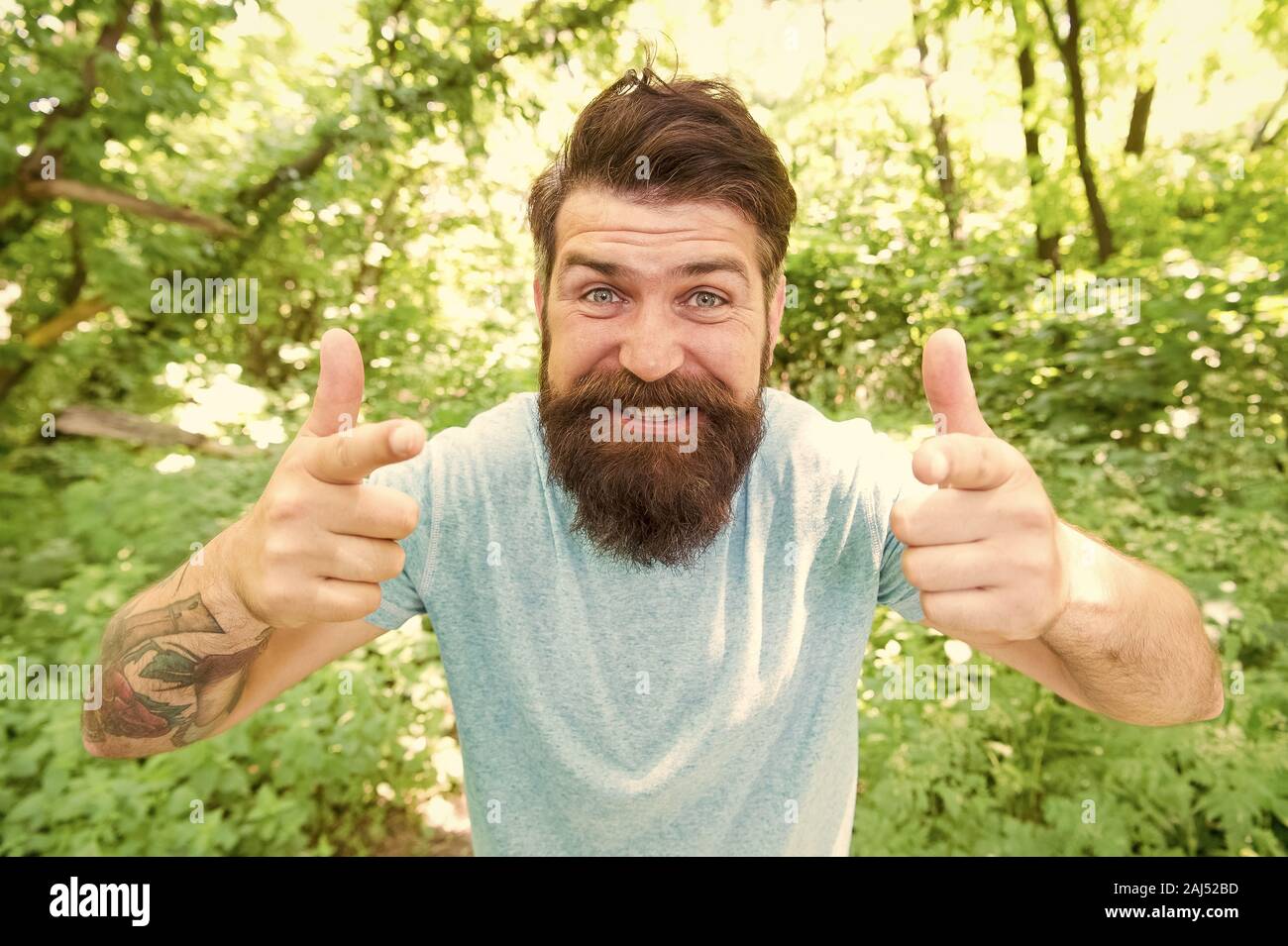 Hipster with long beard emotional face close up nature background. Go ...