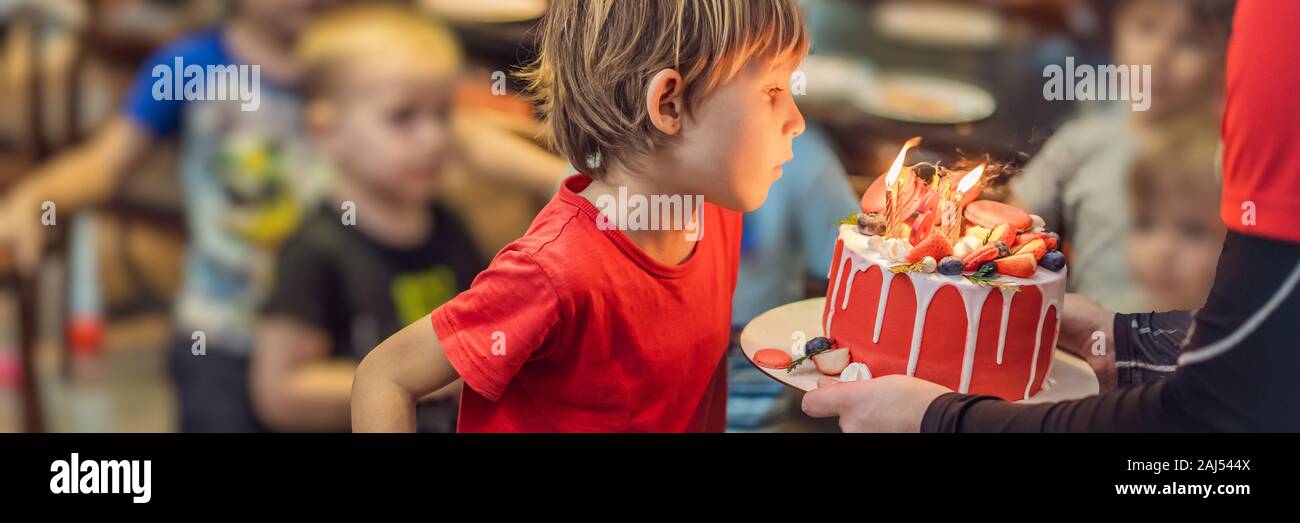 Time to blow out the candles at a child's birthday party. 6 year old ...