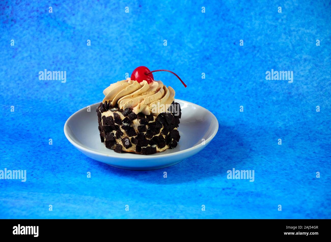 Sponge cake with protein cream, decorated with chocolate chips and ...