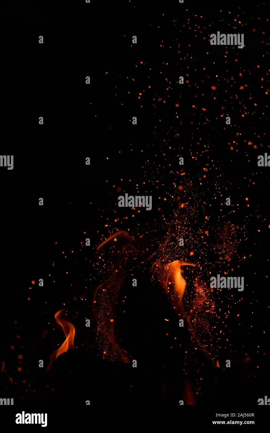 Faint Flames and Embers against black night sky Stock Photo - Alamy