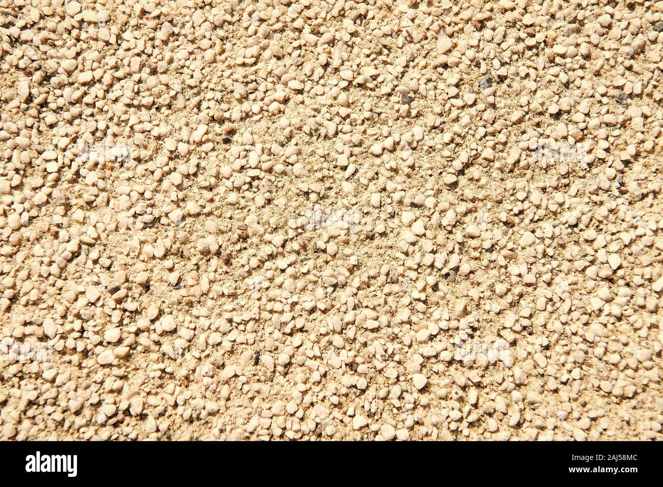 Grainy texture of decorative plaster. Tiny grains little stones in ...
