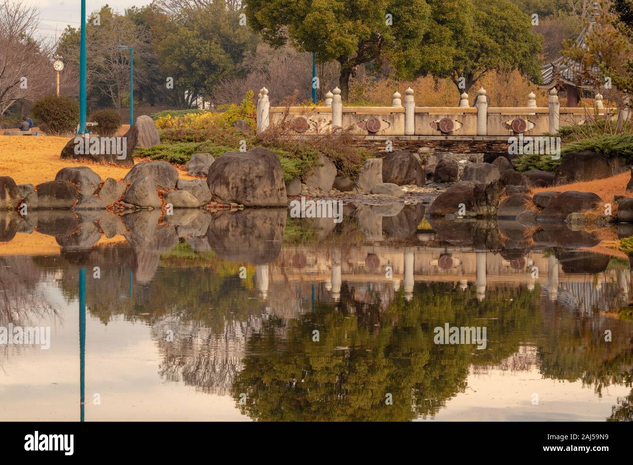 Park lake with a small japanese style bridge in Isesaki city, Japan ...