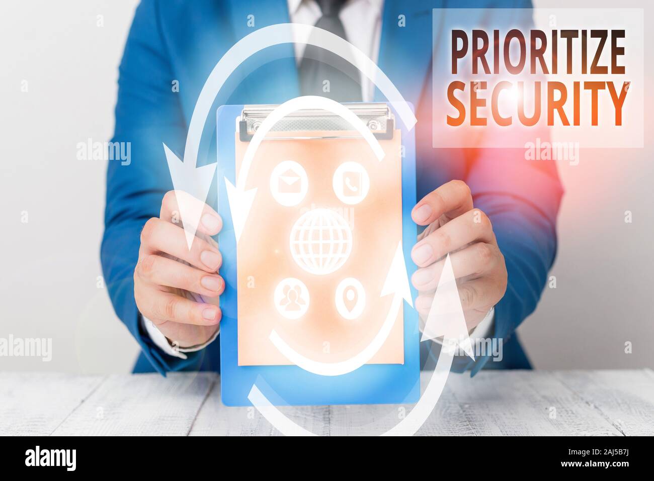 Writing note showing Prioritize Security. Business concept for ...