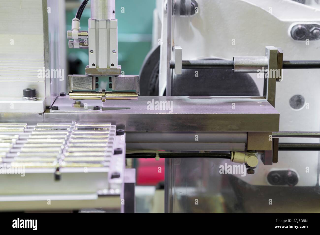 Robot arm pick small machined parts to next manufacturing process ...