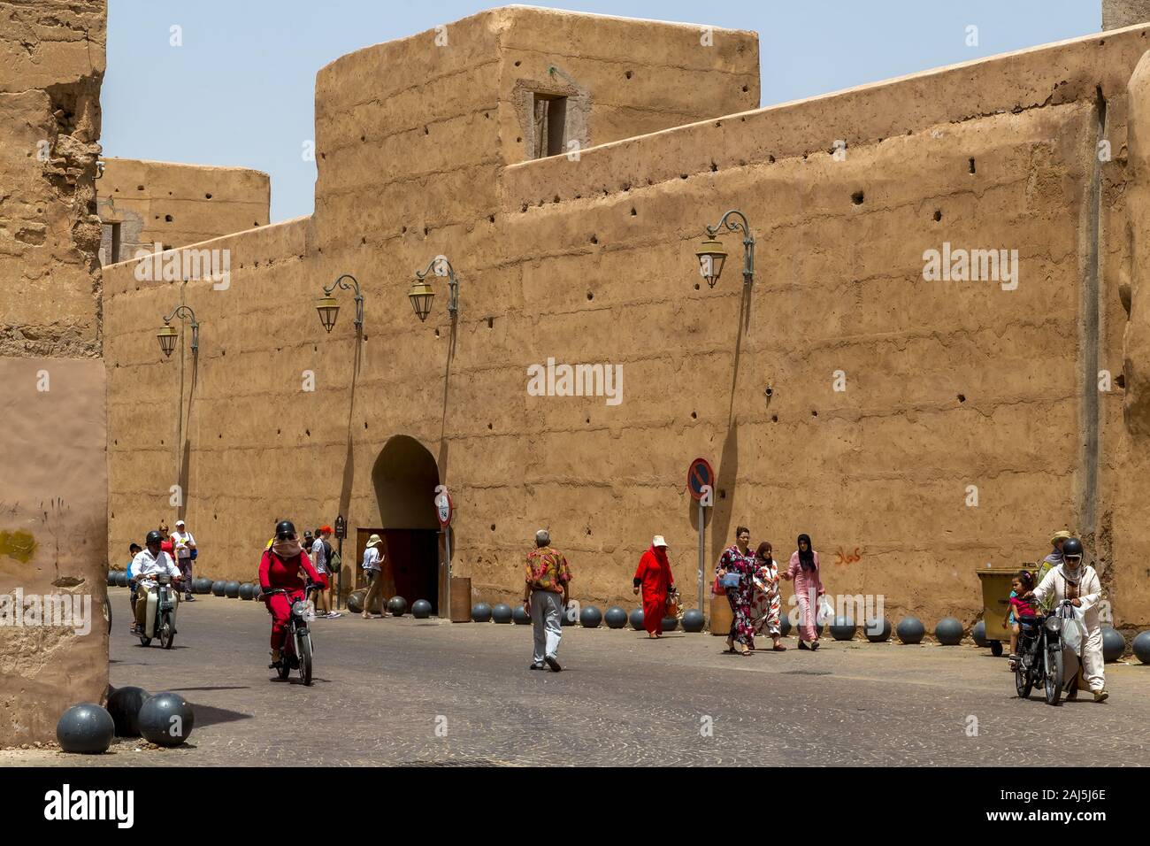 Street of old Medina with the traditional colour wall in Marrakesh ...