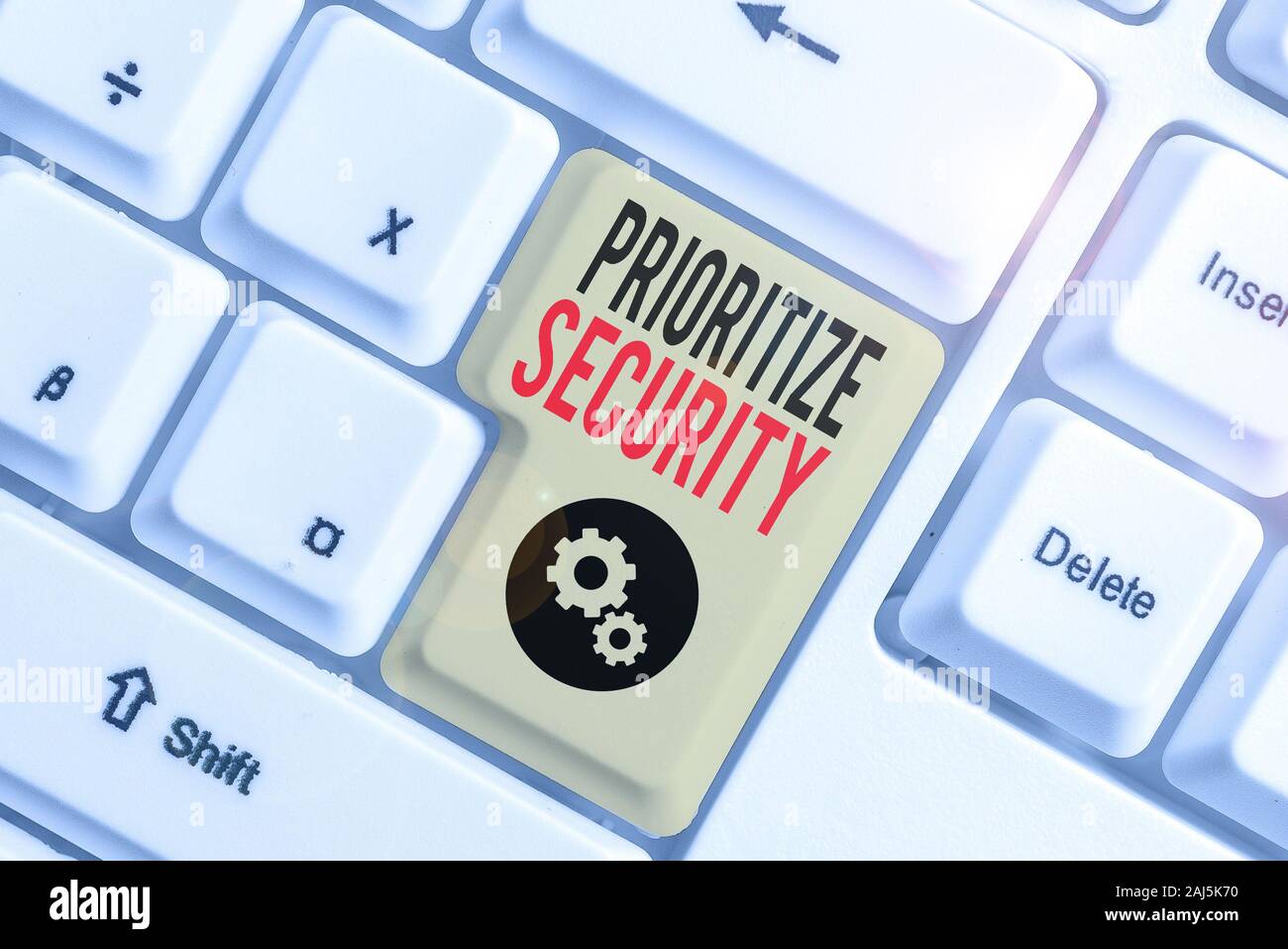 Writing note showing Prioritize Security. Business concept for ...