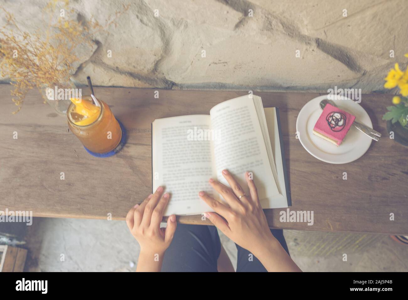 Top view of woman hand reading books Stock Photo - Alamy