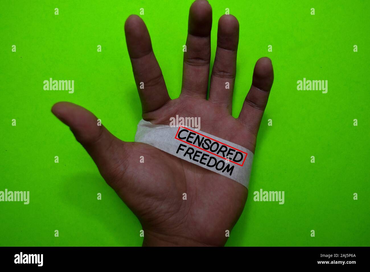Censored Freedom write on Tape in man hand Stock Photo - Alamy