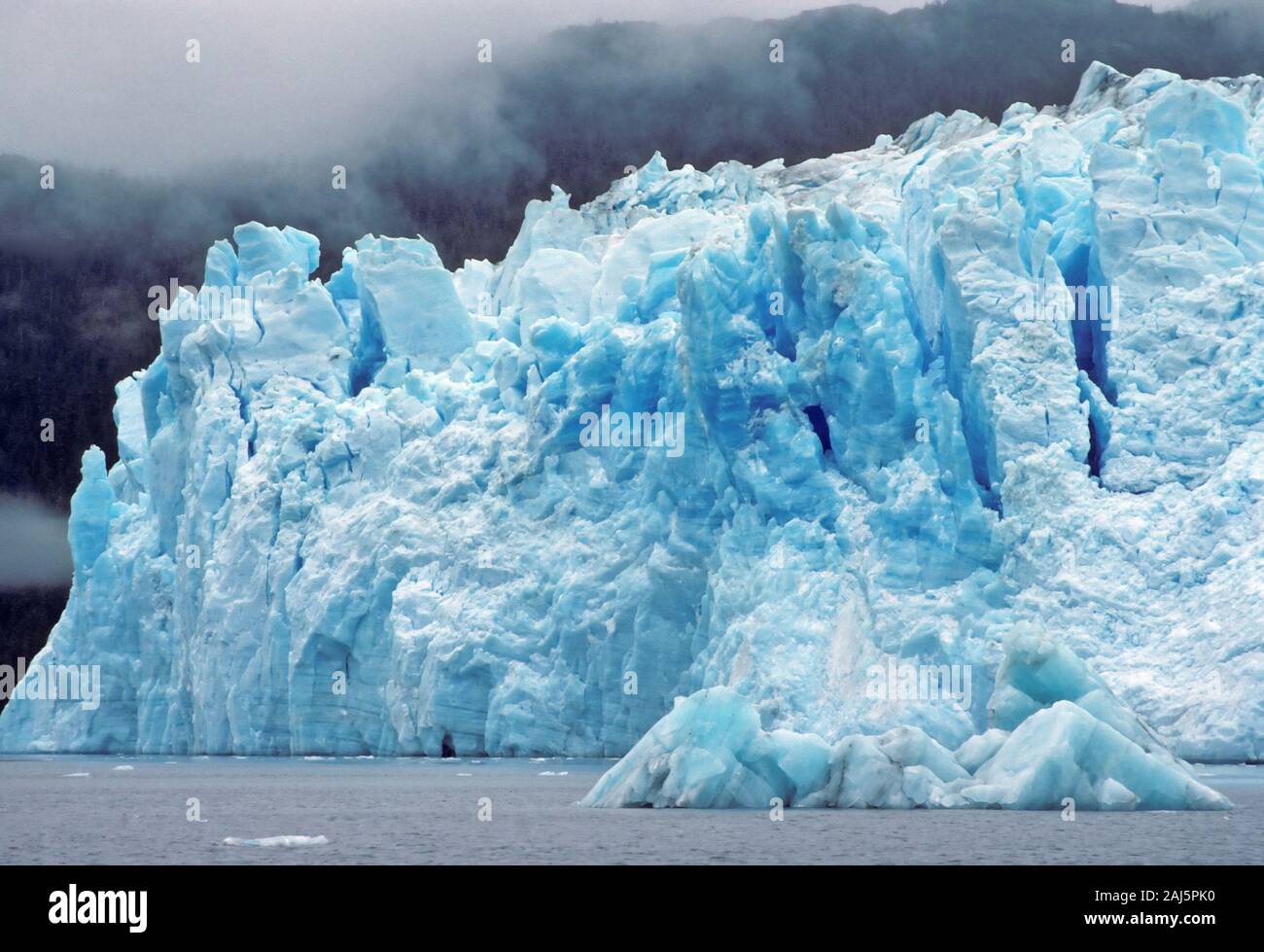 The blue ice of the Columbia Glacier in ocean fog Stock Photo - Alamy