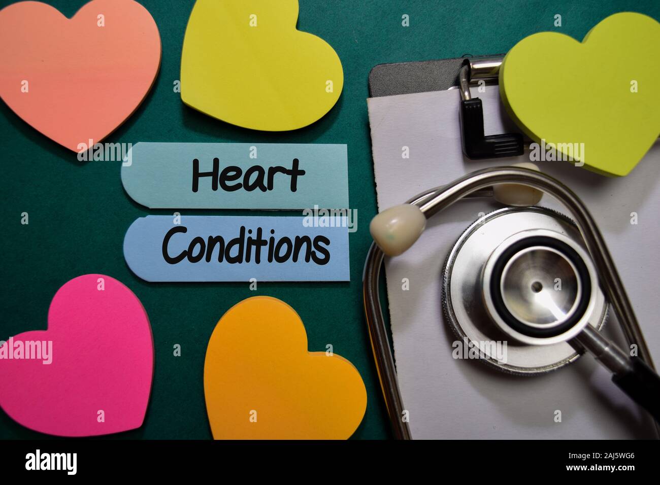 Heart Conditions write on sticky note isolated on Office Desk ...