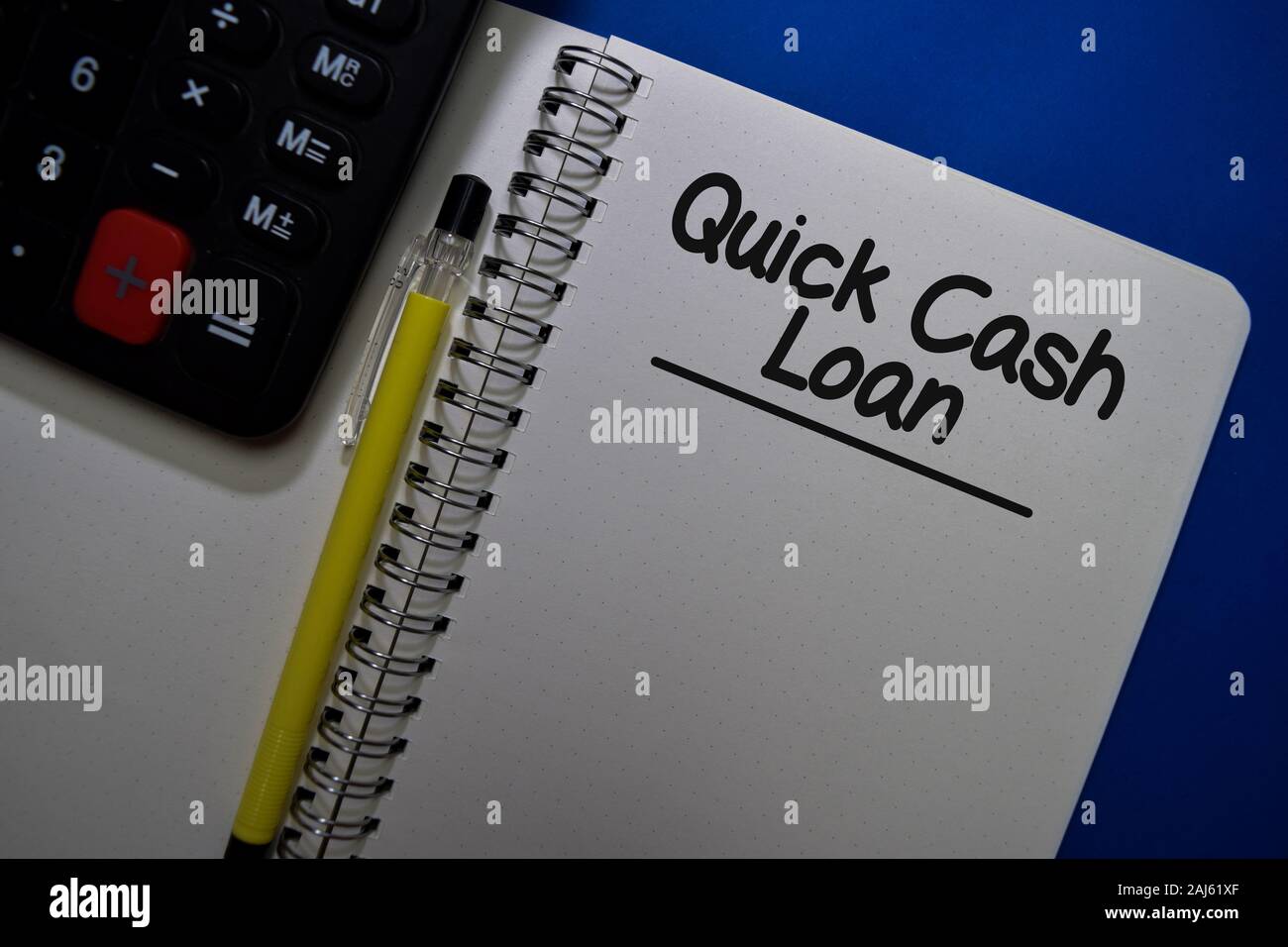 Quick Cash Loan write on a book isolated on Office Desk Stock Photo - Alamy