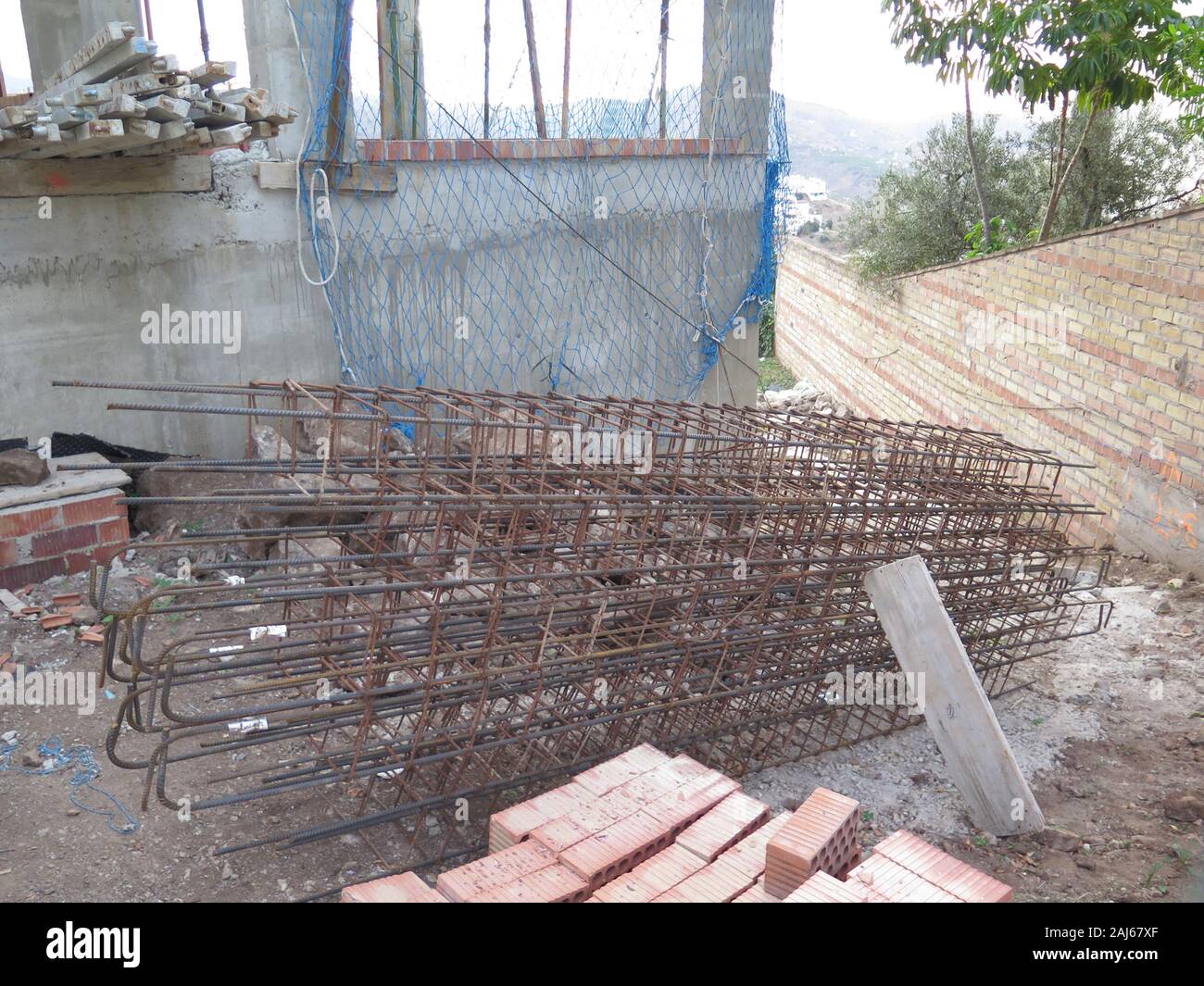 Bent Steel bars for reinforcing concrete pillars Stock Photo - Alamy