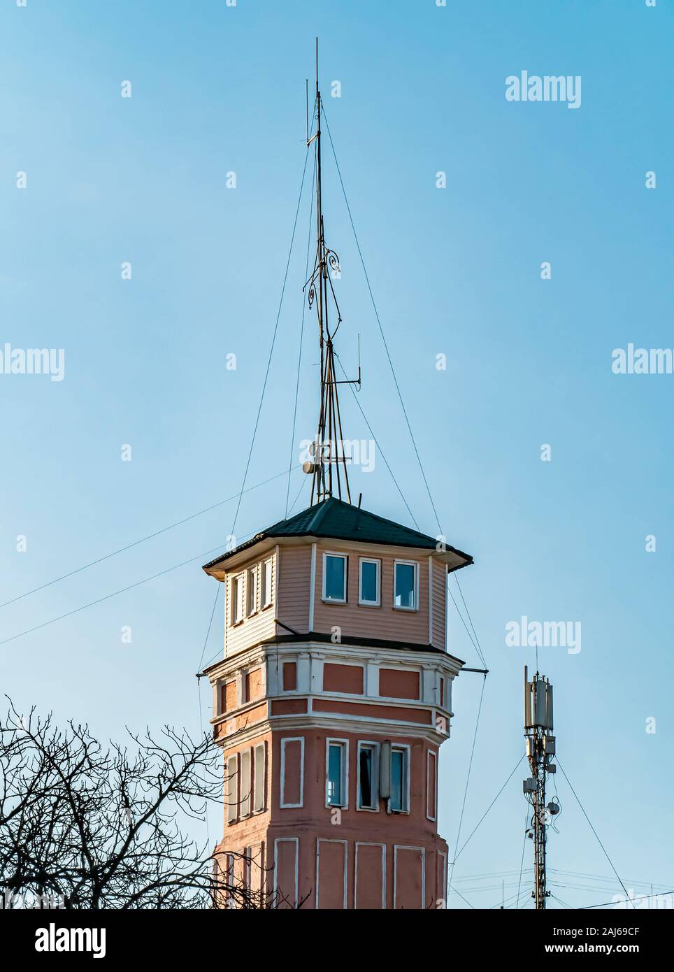 Old fire tower on a background of blue sky. Architecture. Place for ...