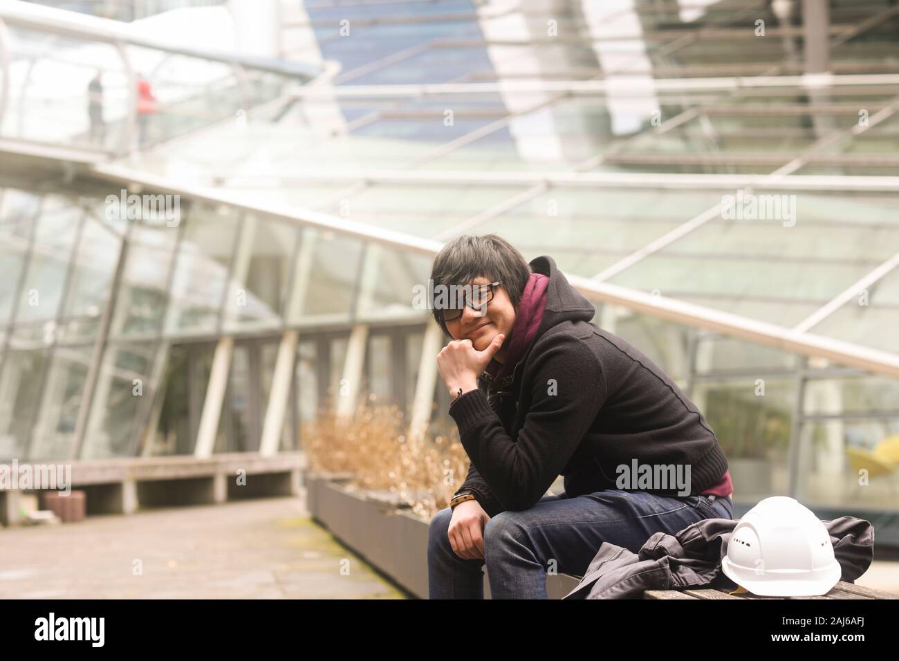 Relaxed man sitting outside hi-res stock photography and images - Alamy