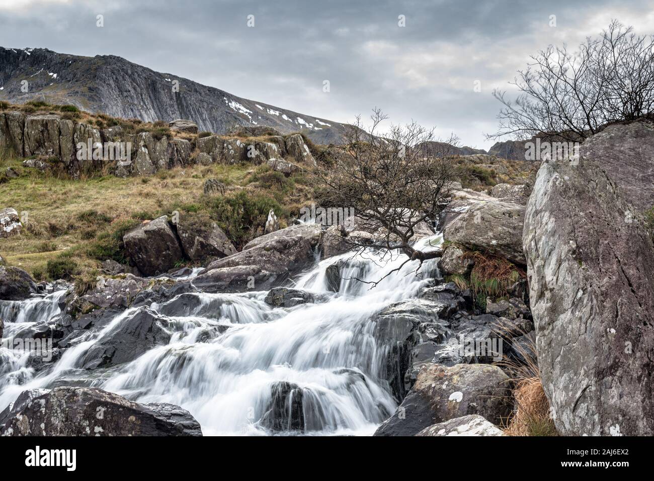 Fast flowing stream at Pont Pen-y-benglog in Snowdonia National Park in ...