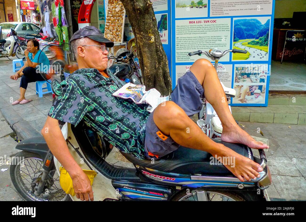 Man sleeping on motorbike hi-res stock photography and images - Alamy