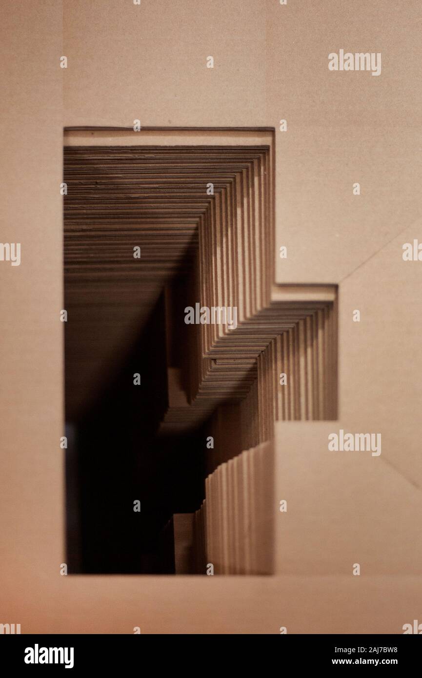Cardboard engineering / cut outs in stack of unassembled cardboard ...