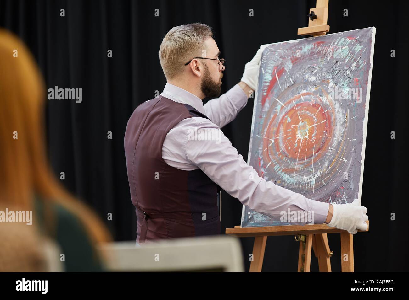 Person presenting painting hi-res stock photography and images - Alamy