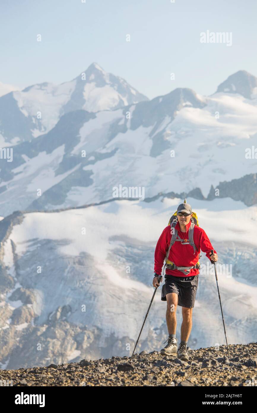 Backpacker hikes across talus slope in B.C. Canada Stock Photo - Alamy