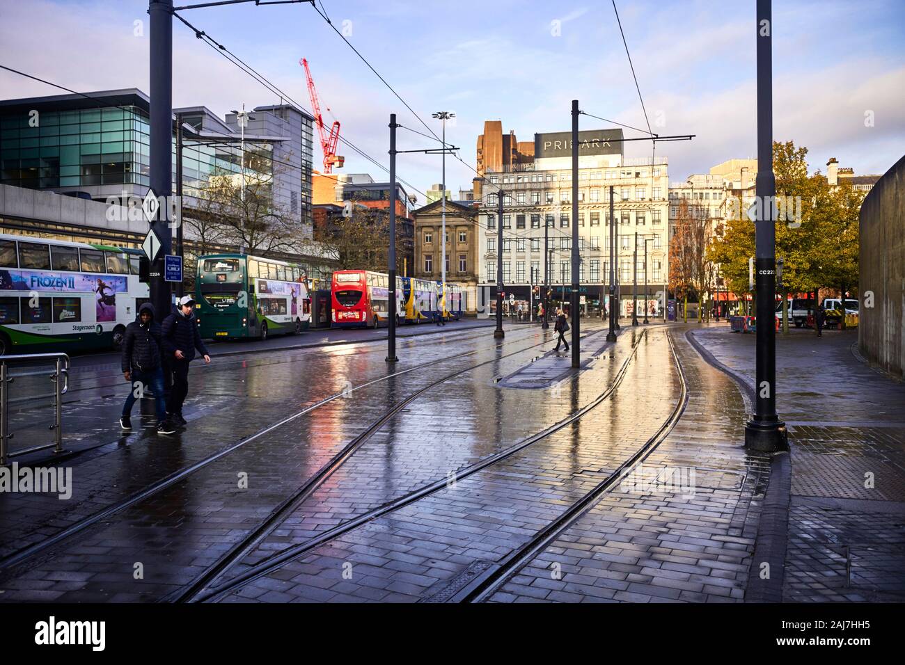 Wet streets and tramlines in Piccadily area of Manchester Stock Photo ...