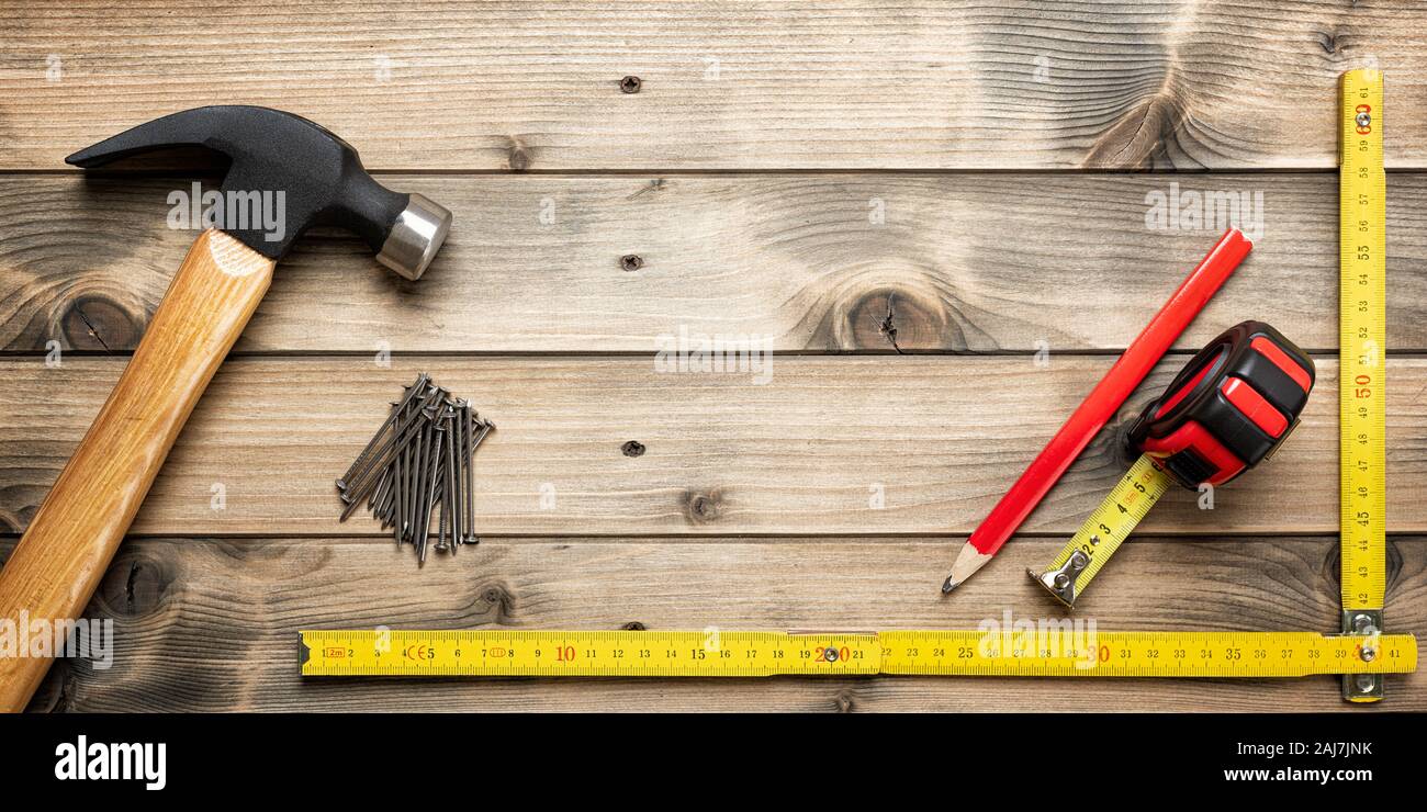 Top view of the hammer and carpenter's work tools on an antique wooden ...