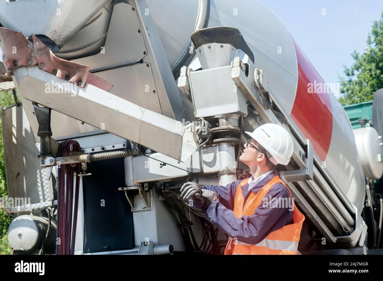 concrete worker checking truck in a concrete factory Stock Photo - Alamy