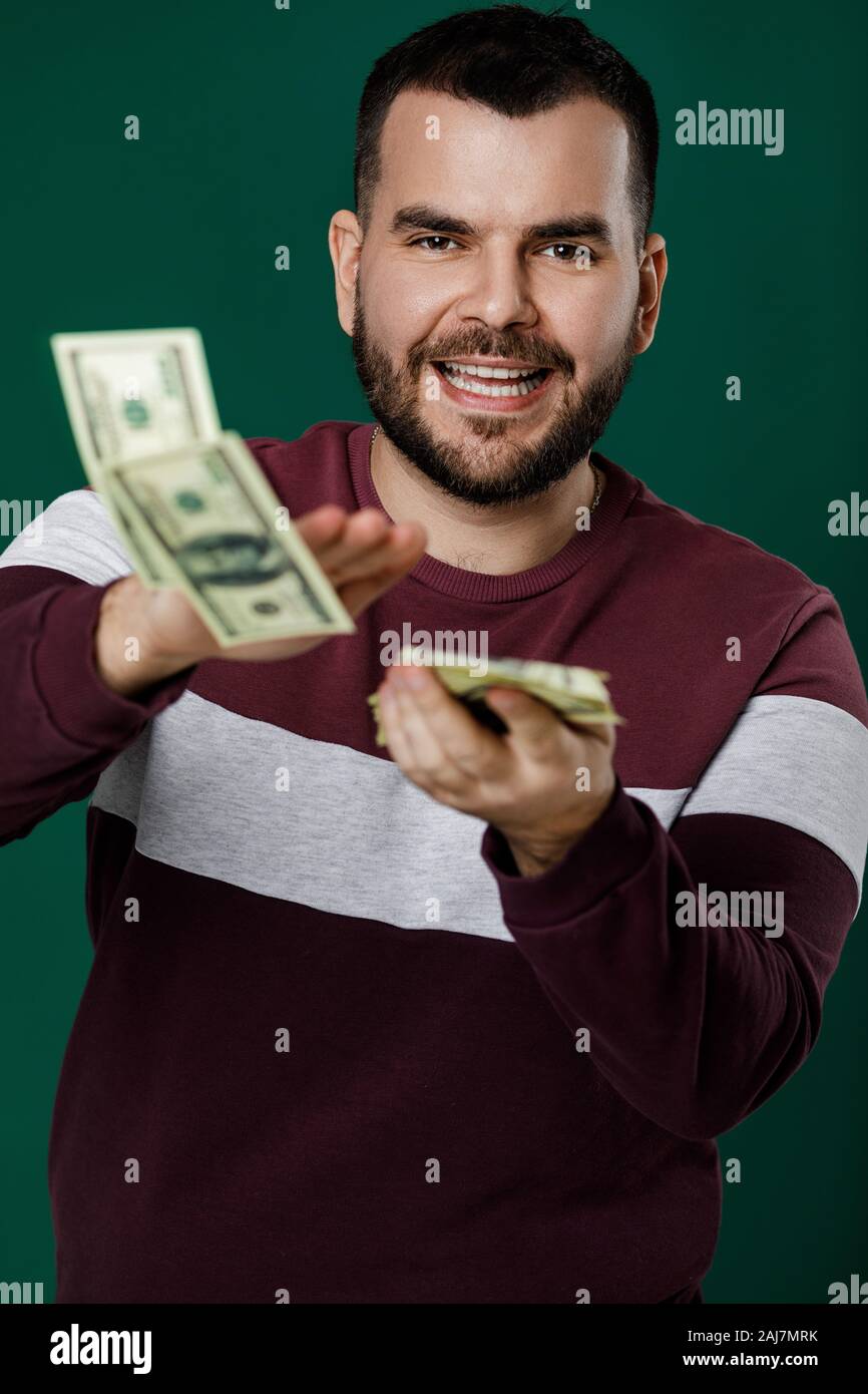 young bearded man throwing money banknotes at camera Stock Photo - Alamy