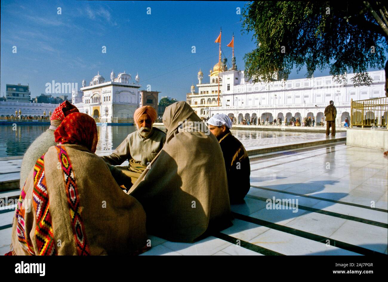 Devotees praying in the Golden Temple Stock Photo - Alamy