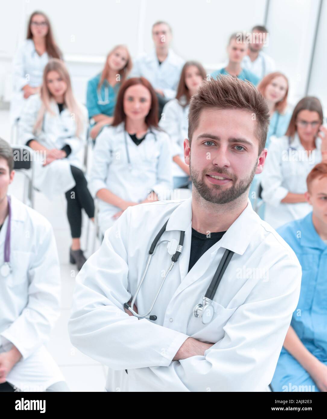close up. confident male doctor standing in conference room Stock Photo ...