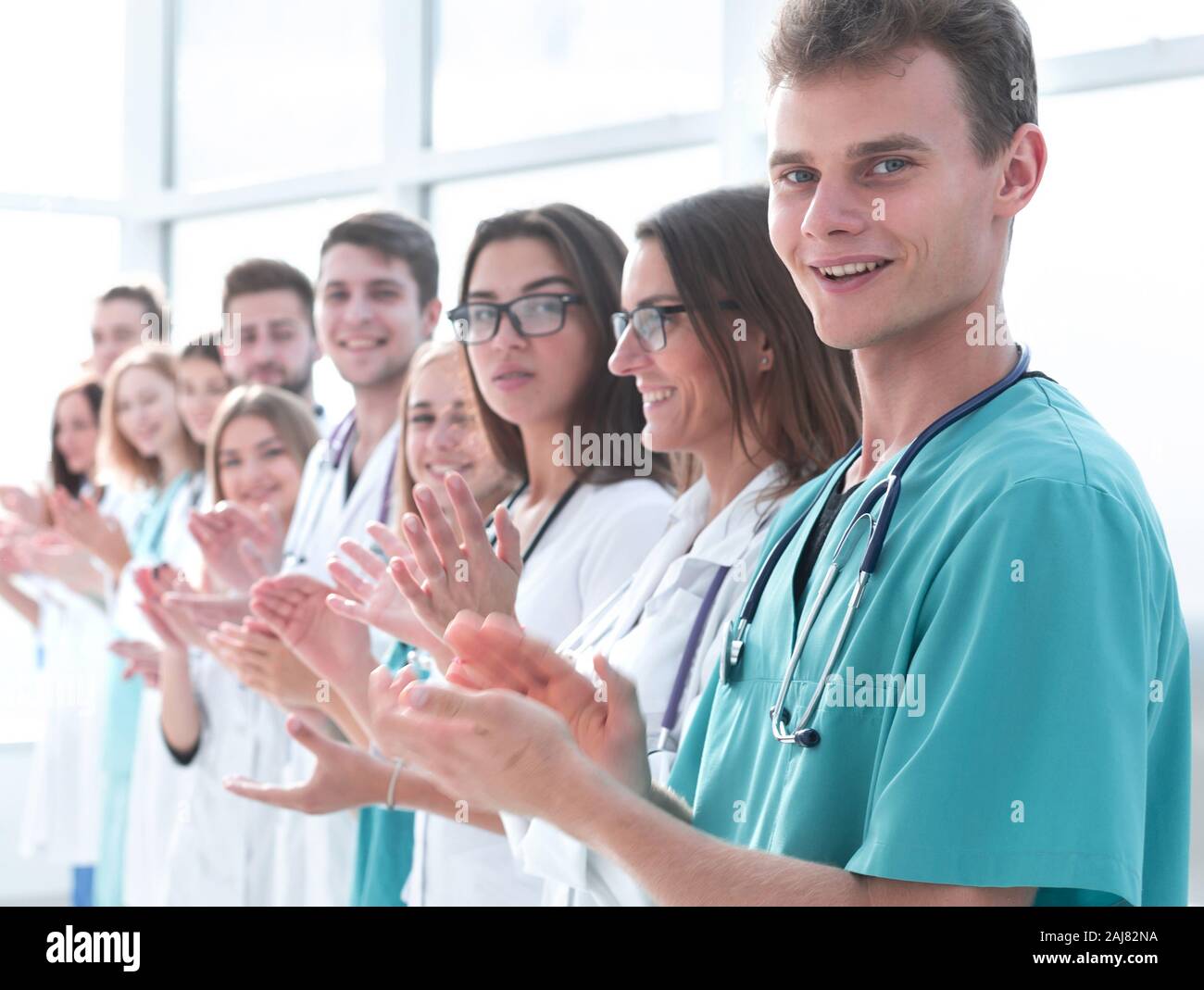 top view. a group of smiling doctors pointing at you Stock Photo - Alamy