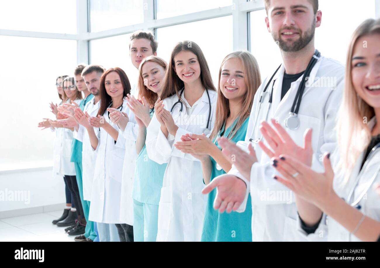 top view. a group of smiling doctors pointing at you Stock Photo - Alamy
