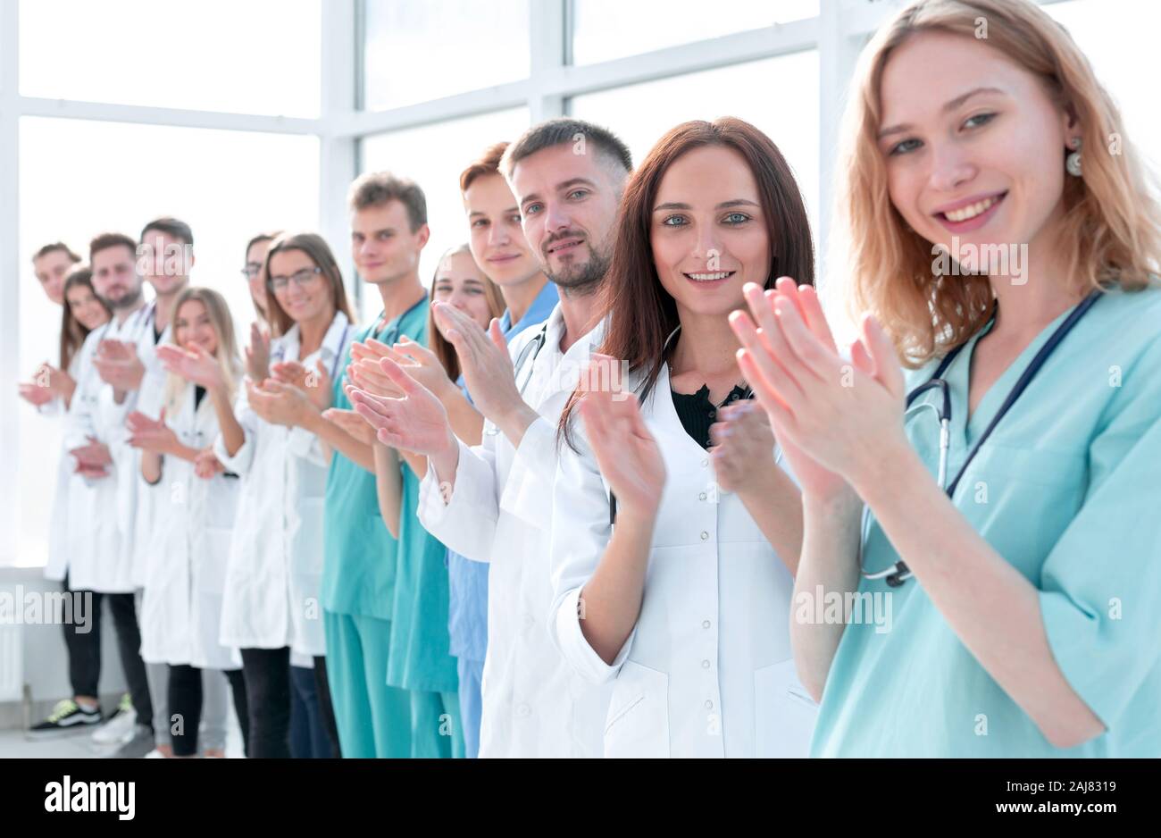 top view. a group of smiling doctors pointing at you Stock Photo - Alamy