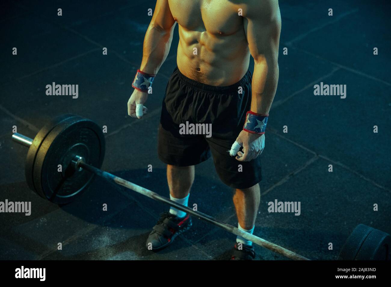 Caucasian man practicing in weightlifting in gym. Caucasian male ...