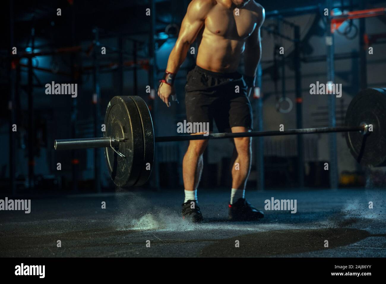 Caucasian man practicing in weightlifting in gym. Caucasian male ...