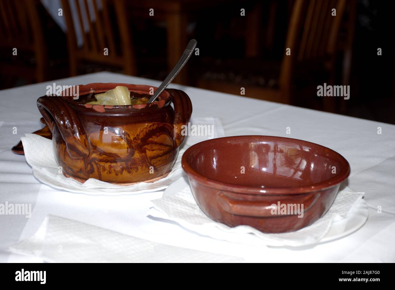 Cooked vegetables in a clay pot on the table in restaurant Stock Photo ...