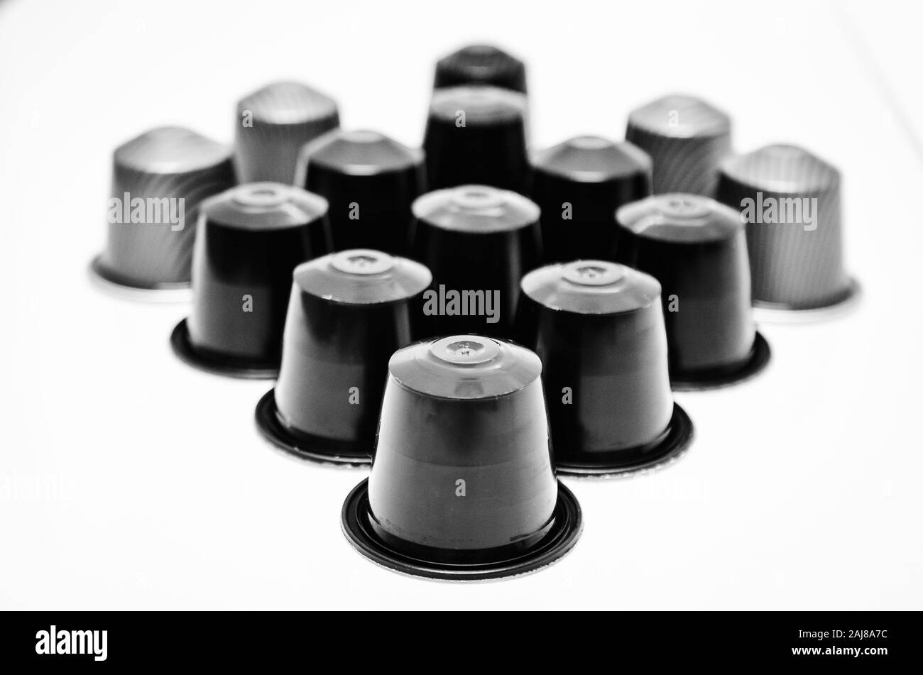 view of some aromatic, tasty espresso coffee capsules in a triangle ...