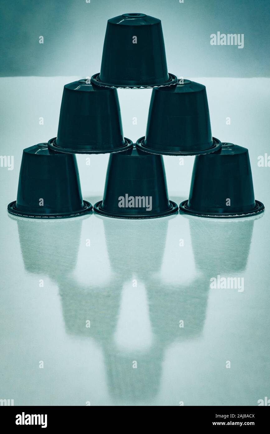 view of some aromatic, tasty espresso coffee capsules in a triangle ...